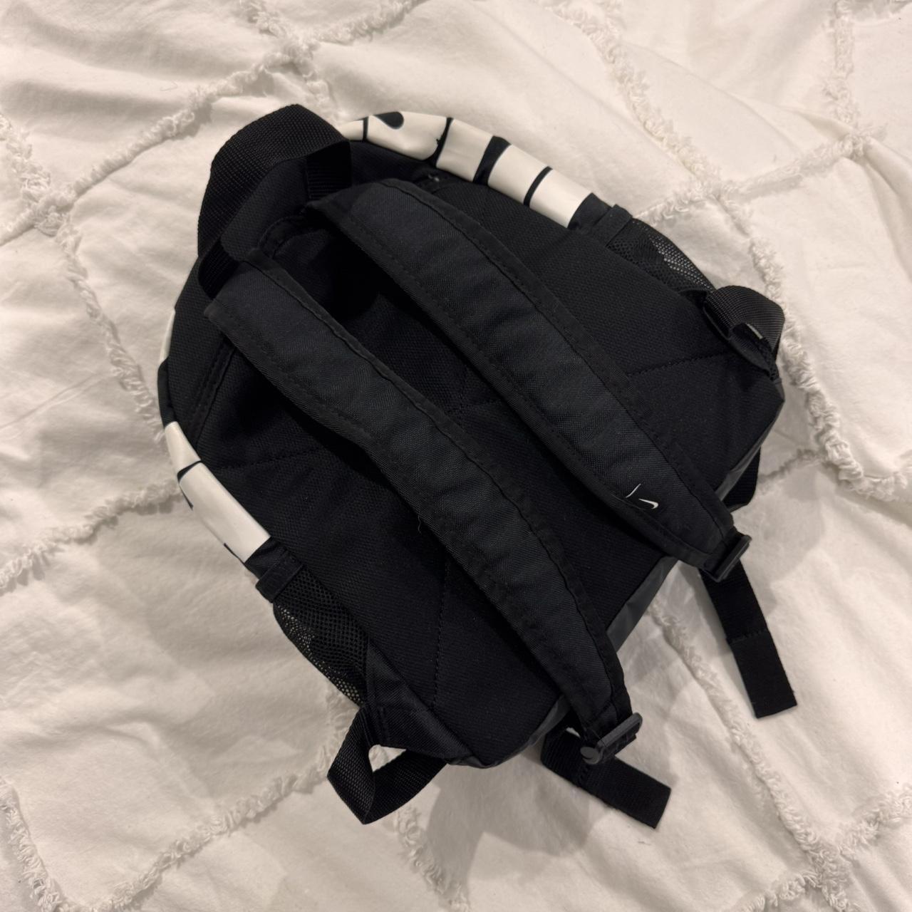 Black and white Nike mini backpack. Used well, but... | Depop