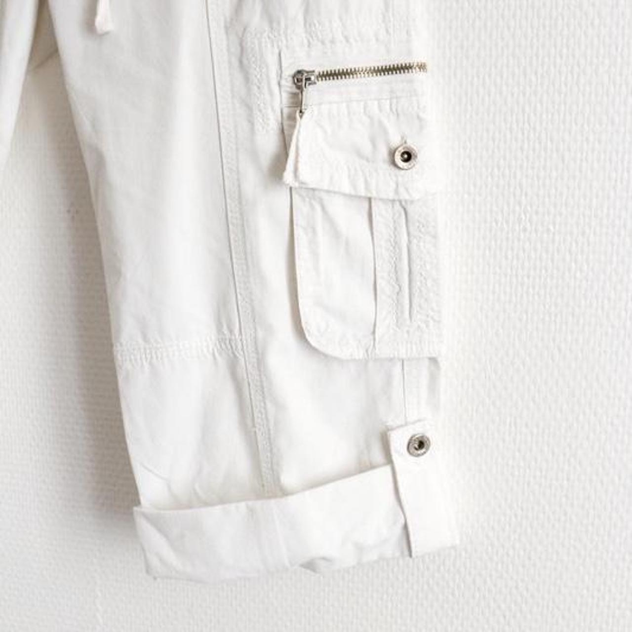 White cargo capri pants with foldable hems. It has... - Depop
