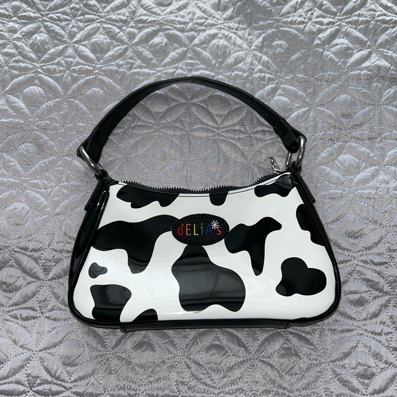 Delia’s cow print mini bag Very cute Used a couple... - Depop