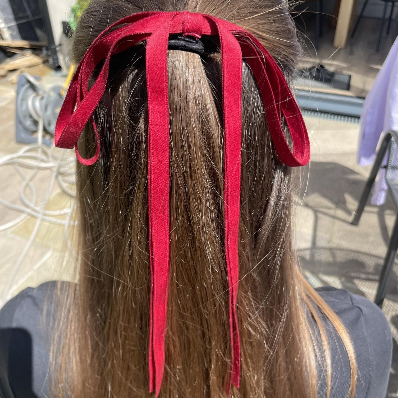 Red ribbon bow attached to a black hair band / hair... - Depop
