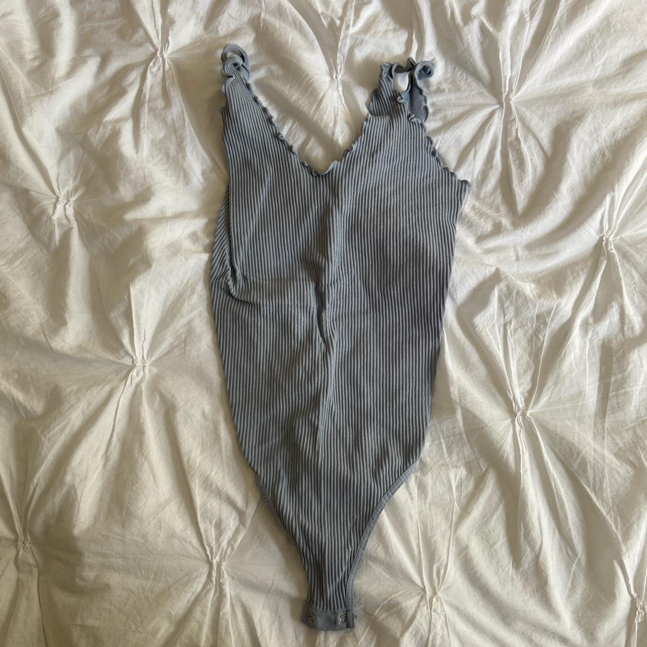 Free people bodysuit in carolina blue with an... - Depop