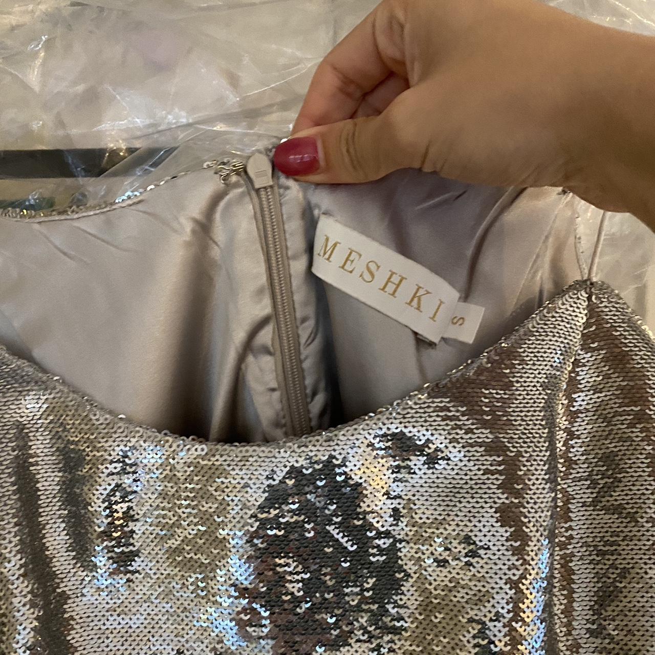 Meshki silver sequin mini dress. Super flattering... - Depop