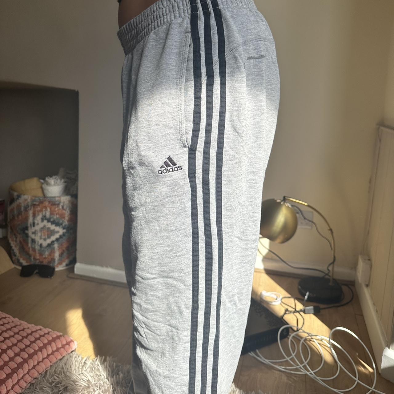 grey adidas trackies, so comfy. Fabric has worn away... - Depop