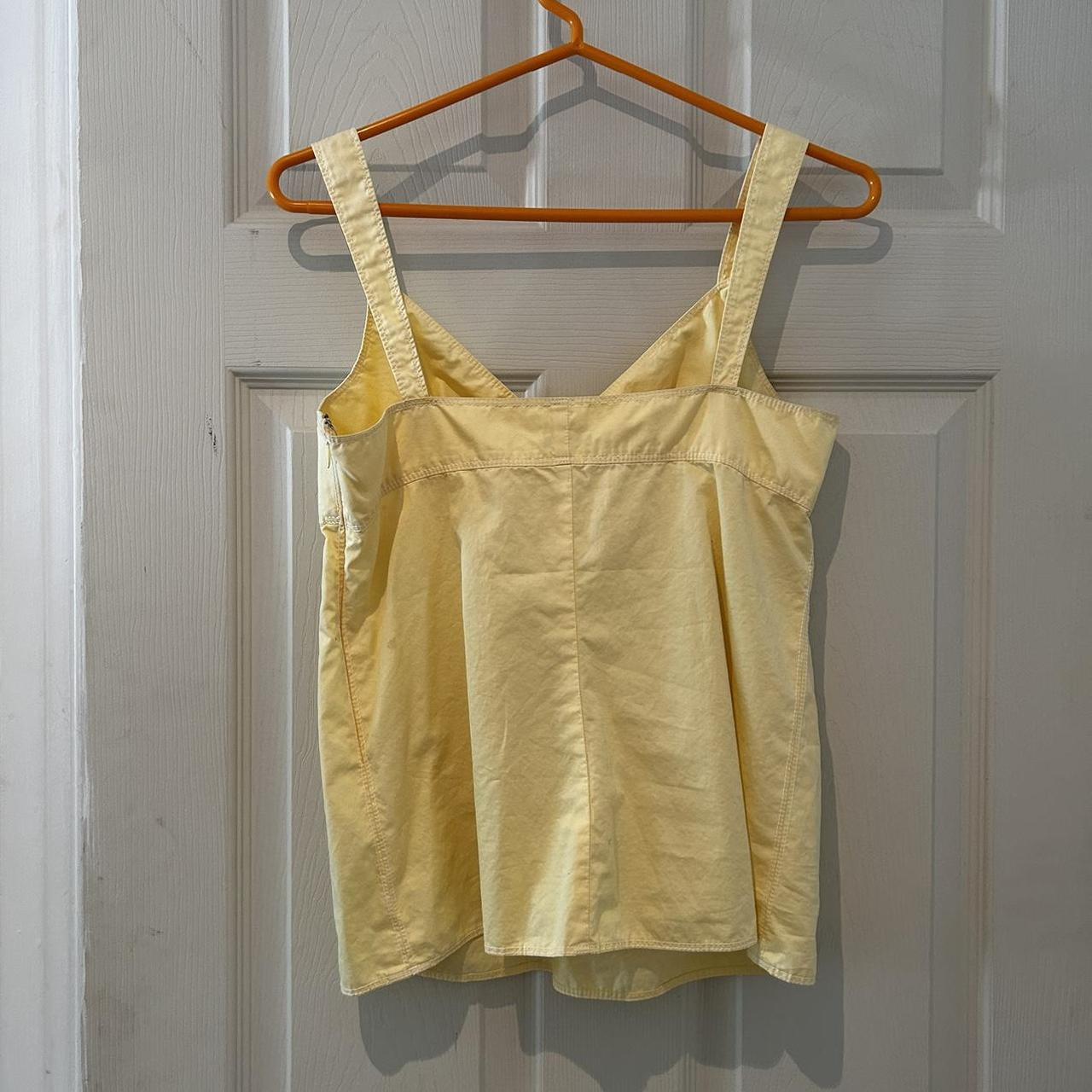 Adorable pale yellow tank top with structured... - Depop