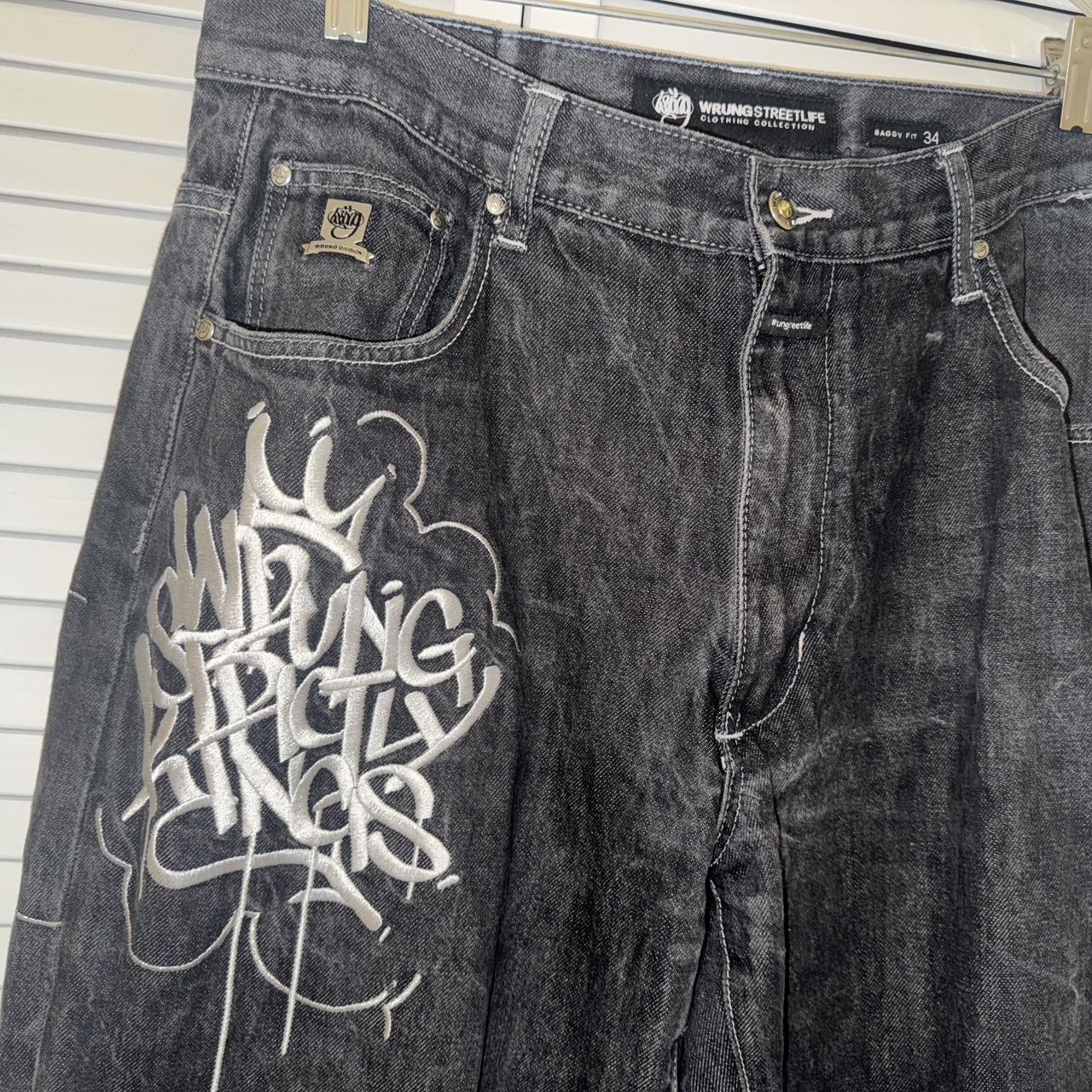 Dark grey embroidered graffiti jeans by... | Depop