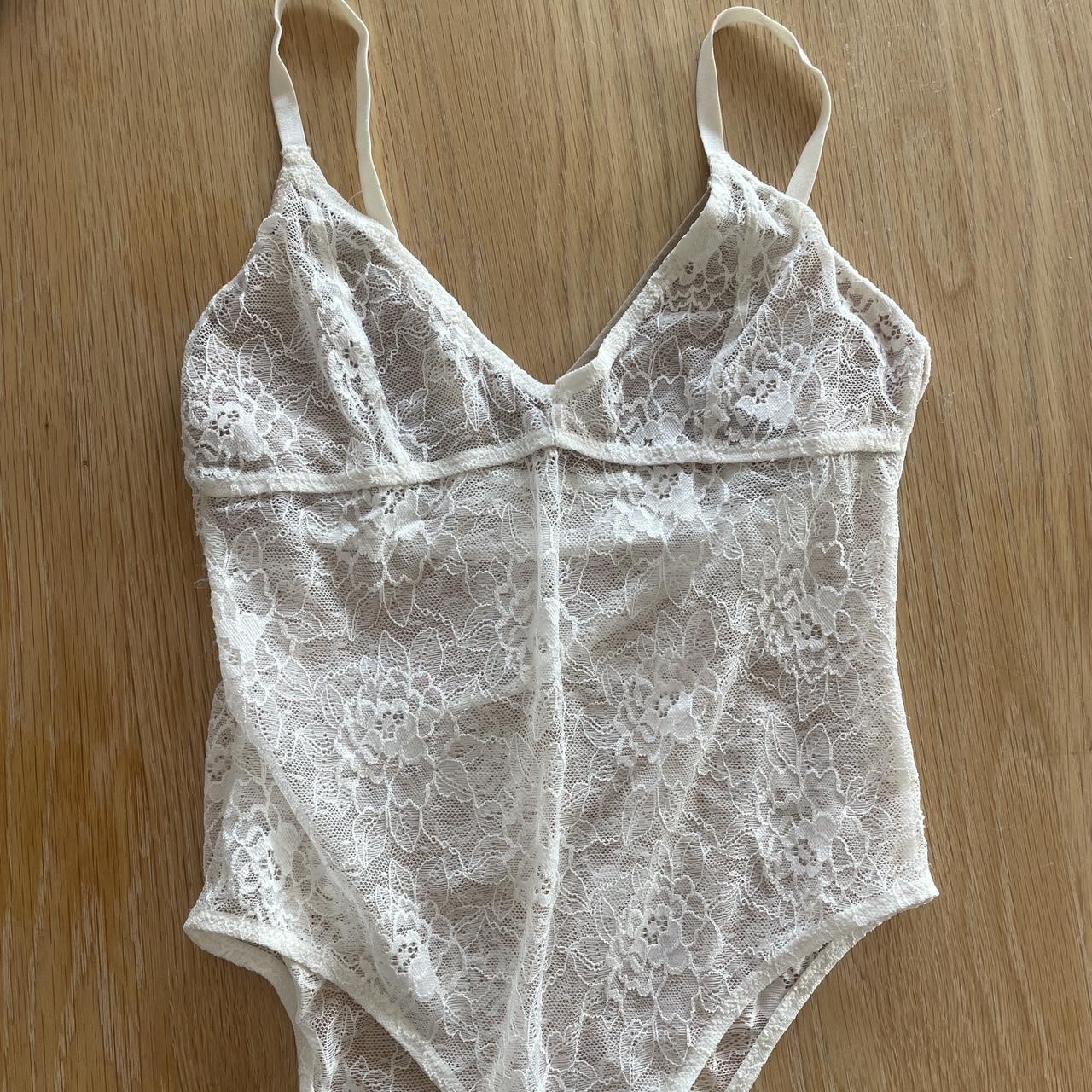 That looks white lace body suit No size marked but... - Depop