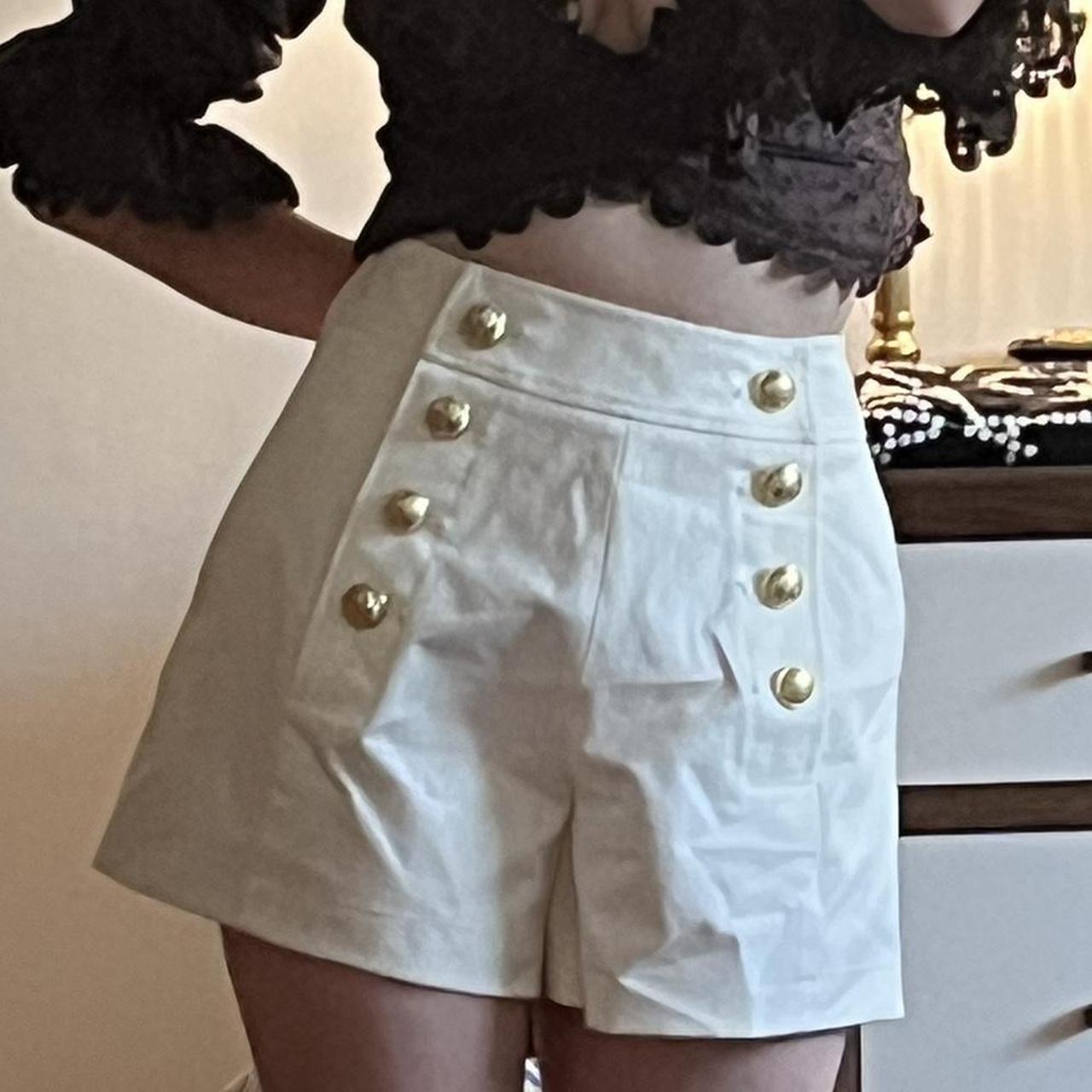 Wide leg white shorts with gold buttons. Great for a... - Depop