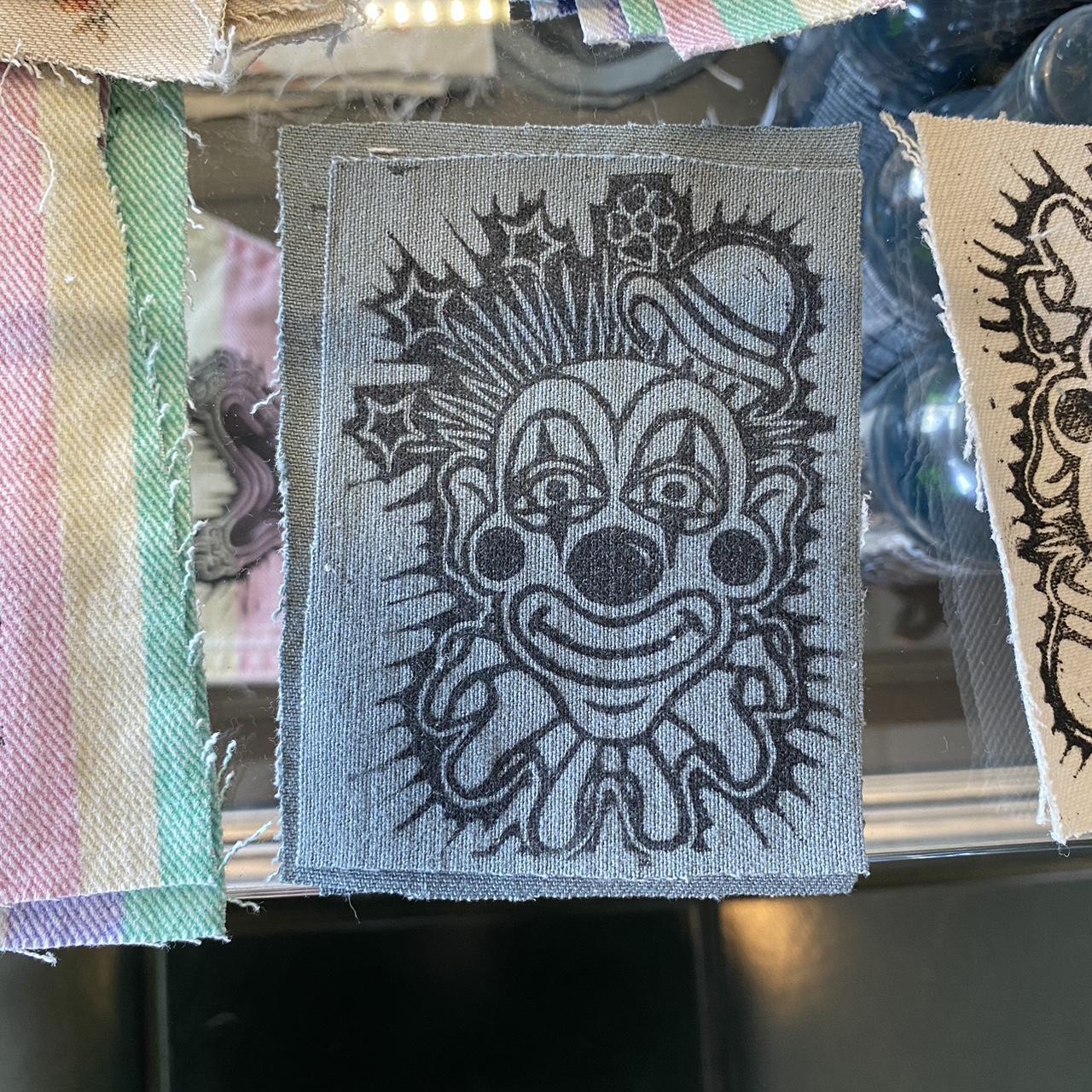 Linocut clown patch on blue denim fabric... | Depop