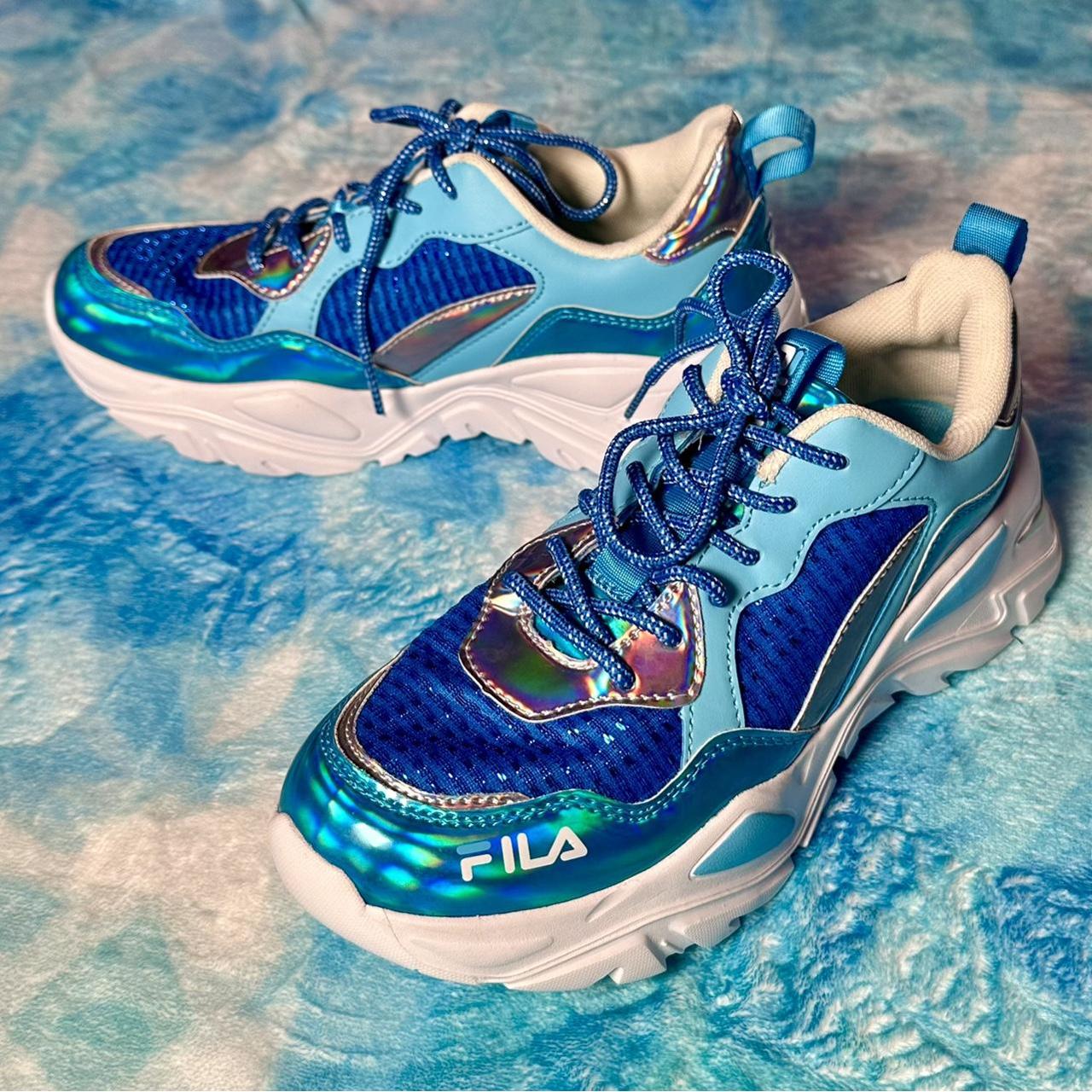 Brand new, never worn, shiny holographic blue Fila... - Depop