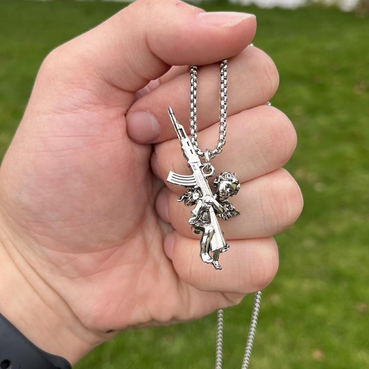 Y2k skater style Cupid with an AK necklace. Good... - Depop