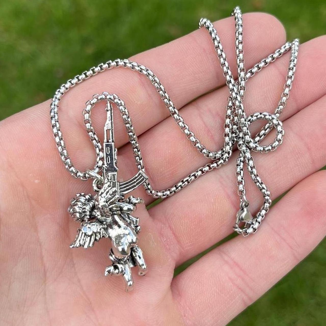 Y2k skater style Cupid with an AK necklace. Good... - Depop