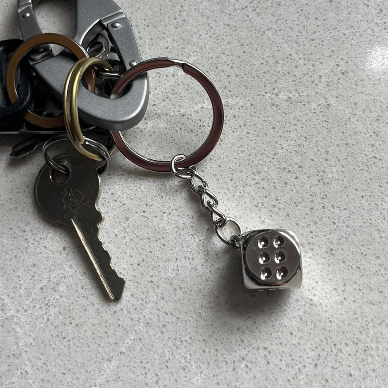 Y2k style metal silver dice keychain Brand new and... - Depop