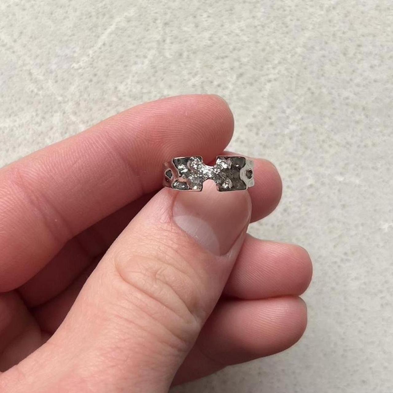 Vintage Y2K skater style silver colored ring. Brand... - Depop