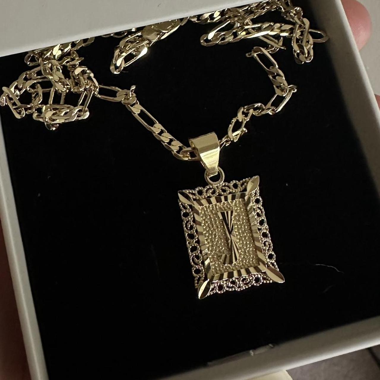 18k gold plated Cuban link chain necklace with a... - Depop