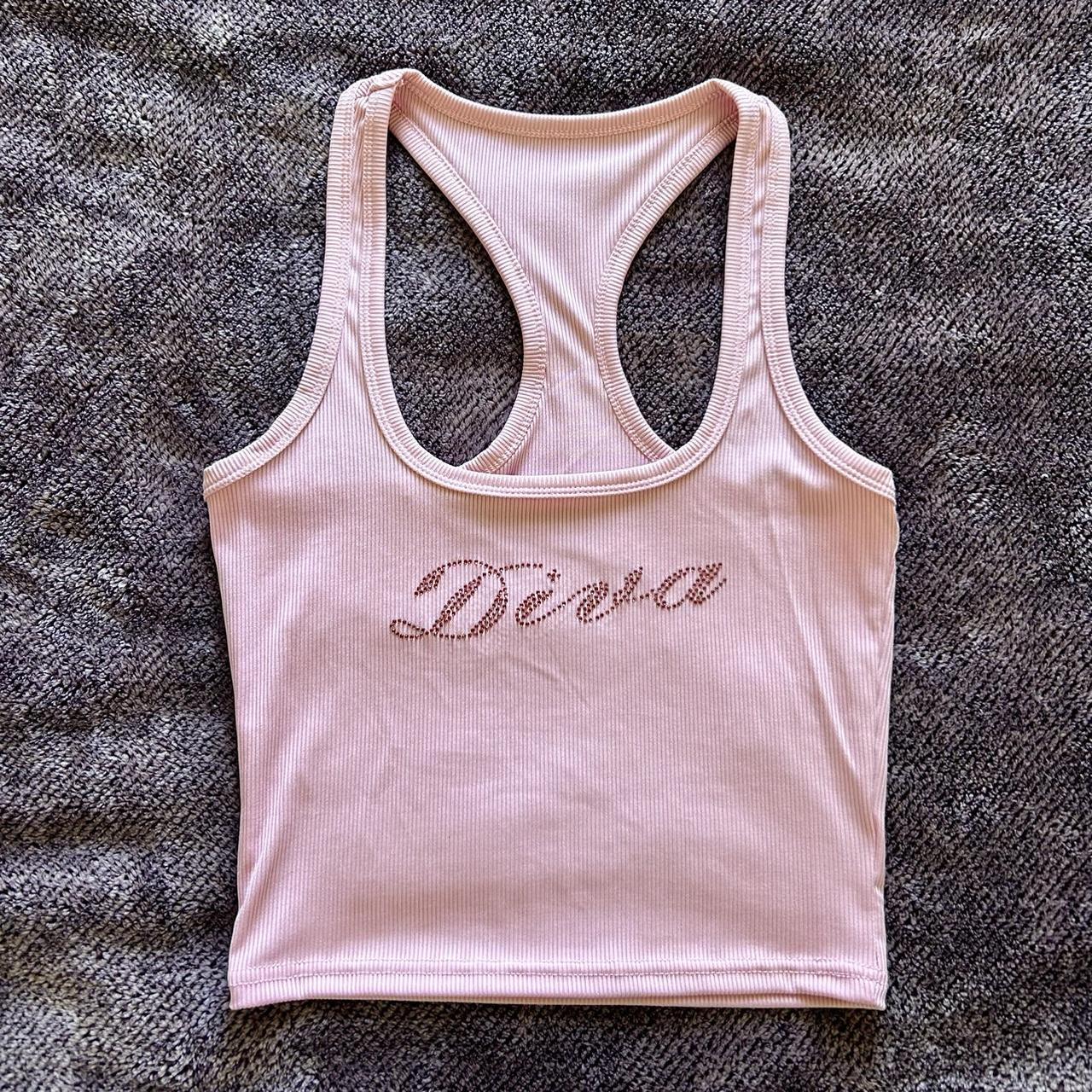 super cute bedazzled razorback tank! the fit is... - Depop
