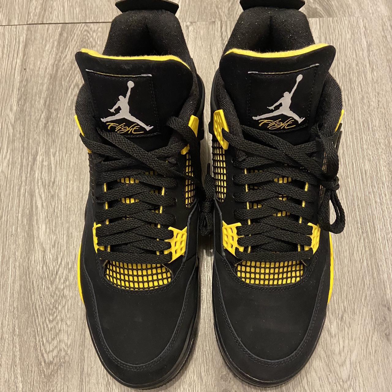 Jordan 4 black/Yellow retro. Worn once - Depop