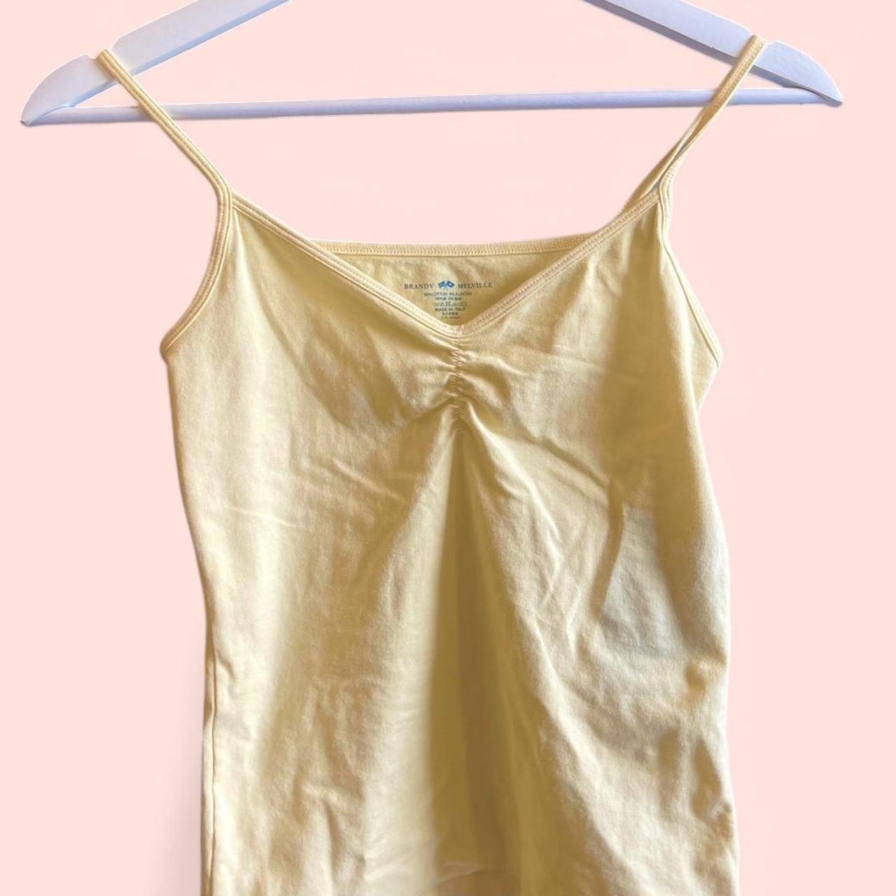 NWT pastel yellow tank from brandy Melville with... | Depop