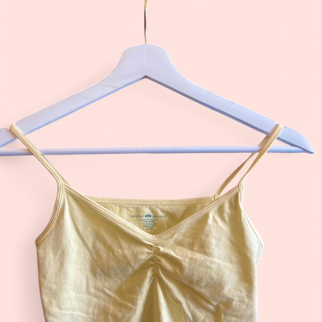 NWT pastel yellow tank from brandy Melville with... | Depop