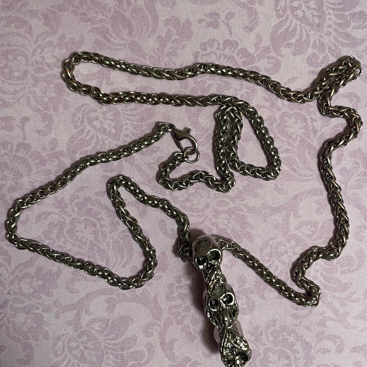 silver skull chain • chain is turning a little... | Depop