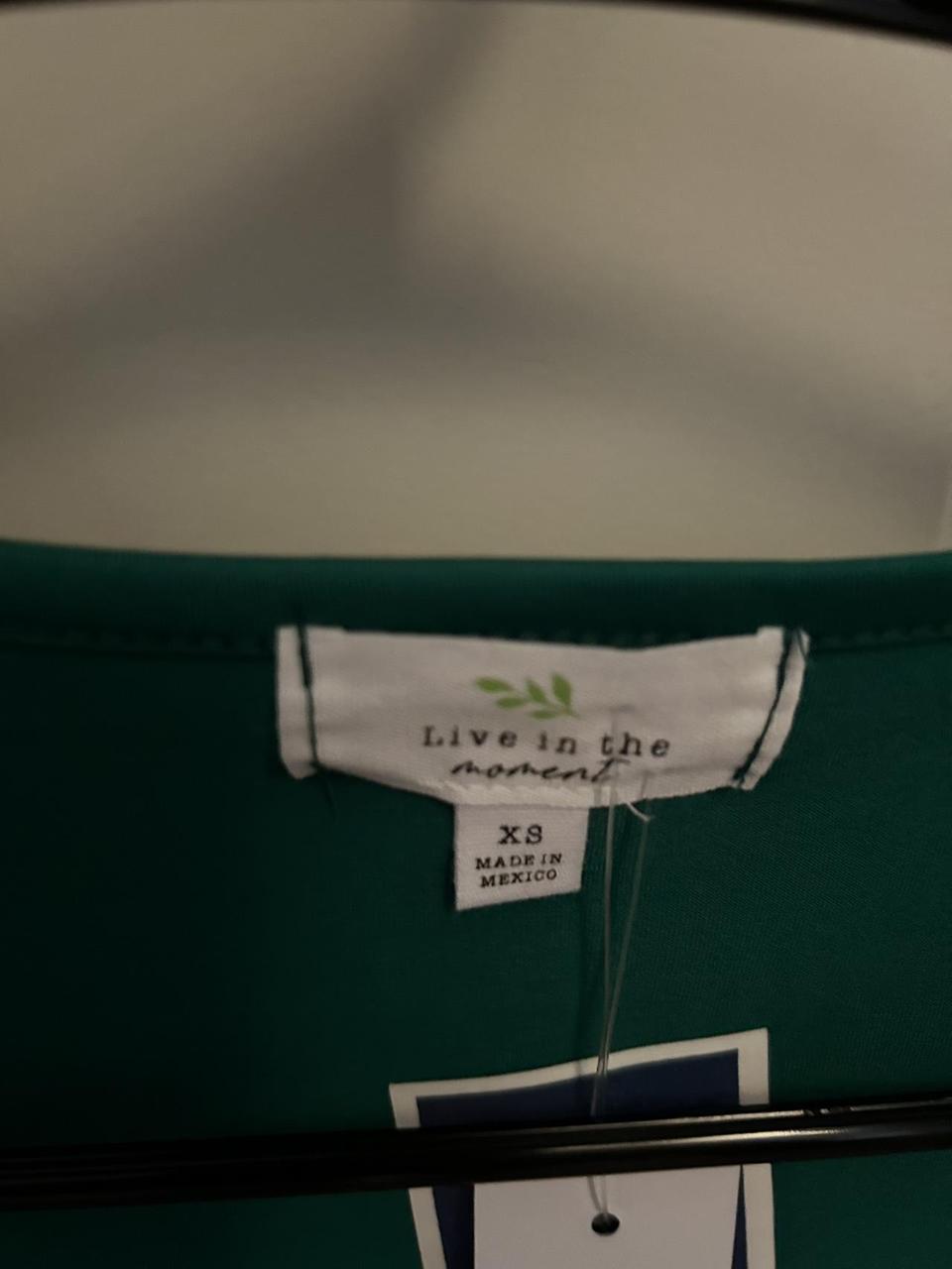 Green going out top. NEW WITH TAGS. Xs, but fits... - Depop