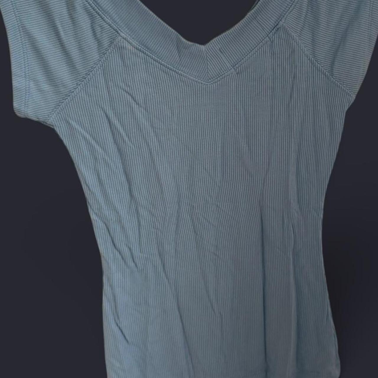 BDG baby blue form fitting crop top. slight stains... | Depop