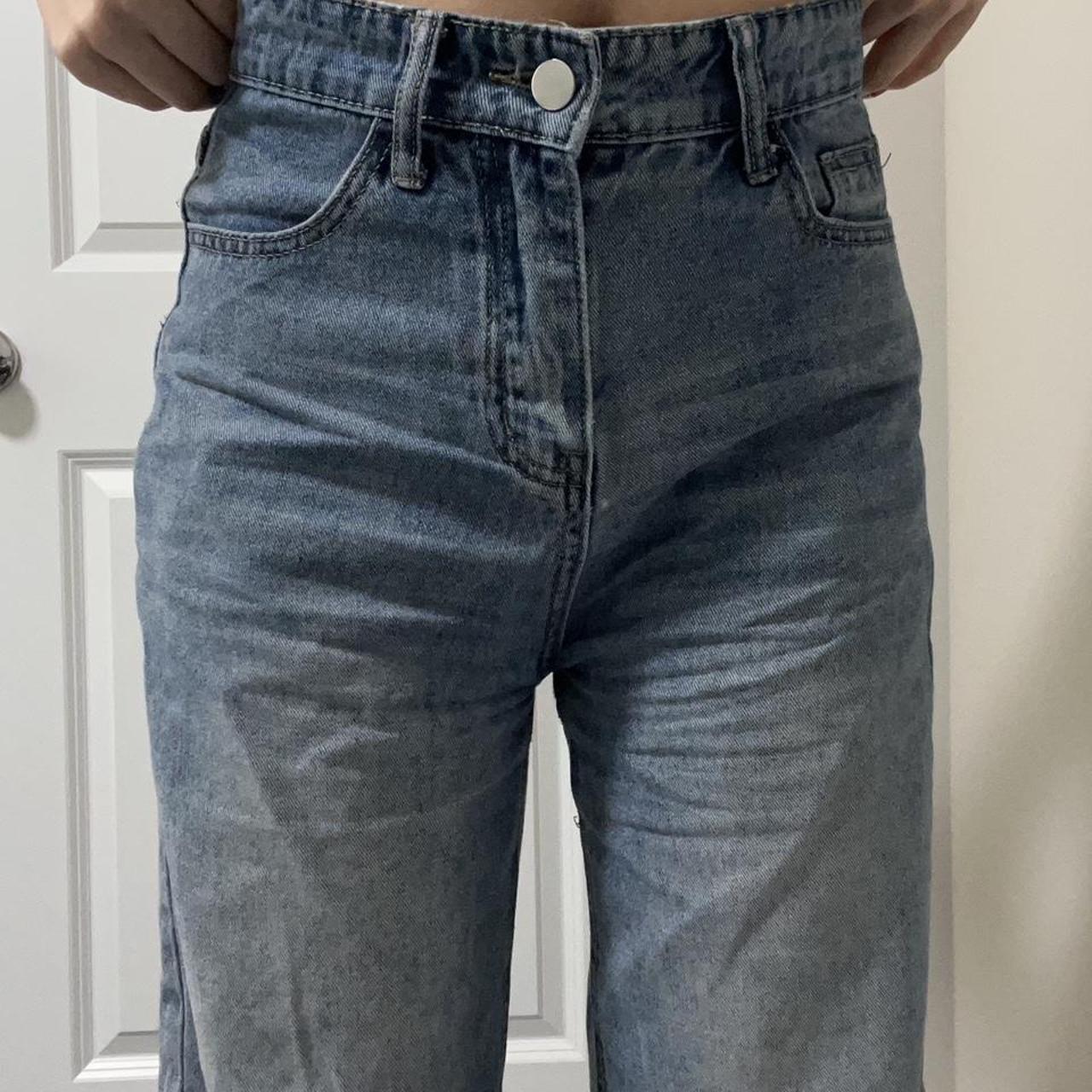 High-waisted blue denim jeans with a relaxed fit... | Depop