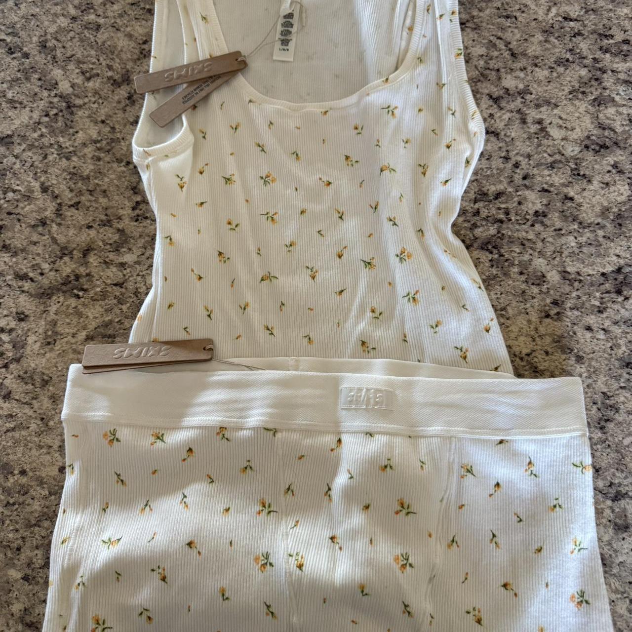 Beautiful skims white and green floral tank top and... | Depop