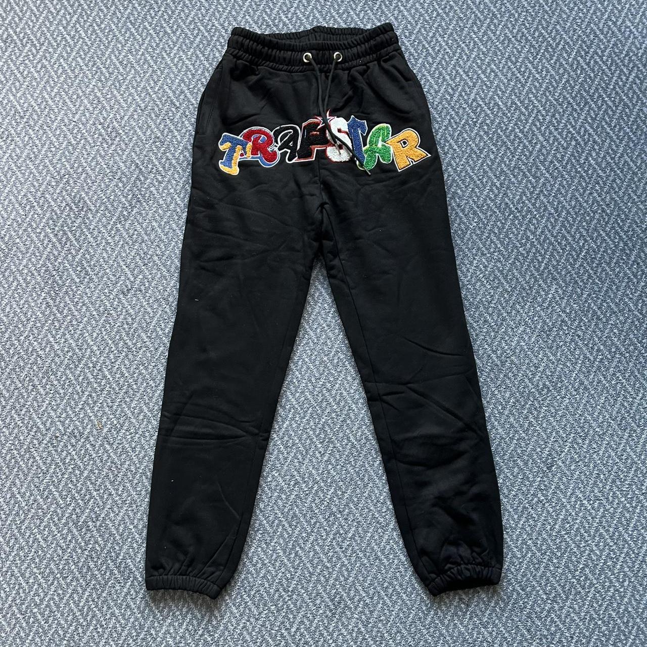 Black Trapstar joggers with embroidered logo and... | Depop