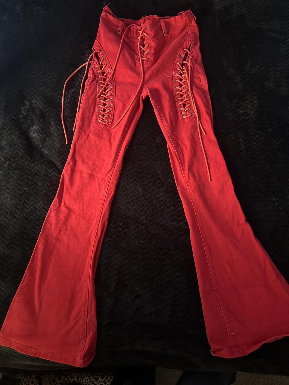Red flare jeans with lace-up details... - Depop