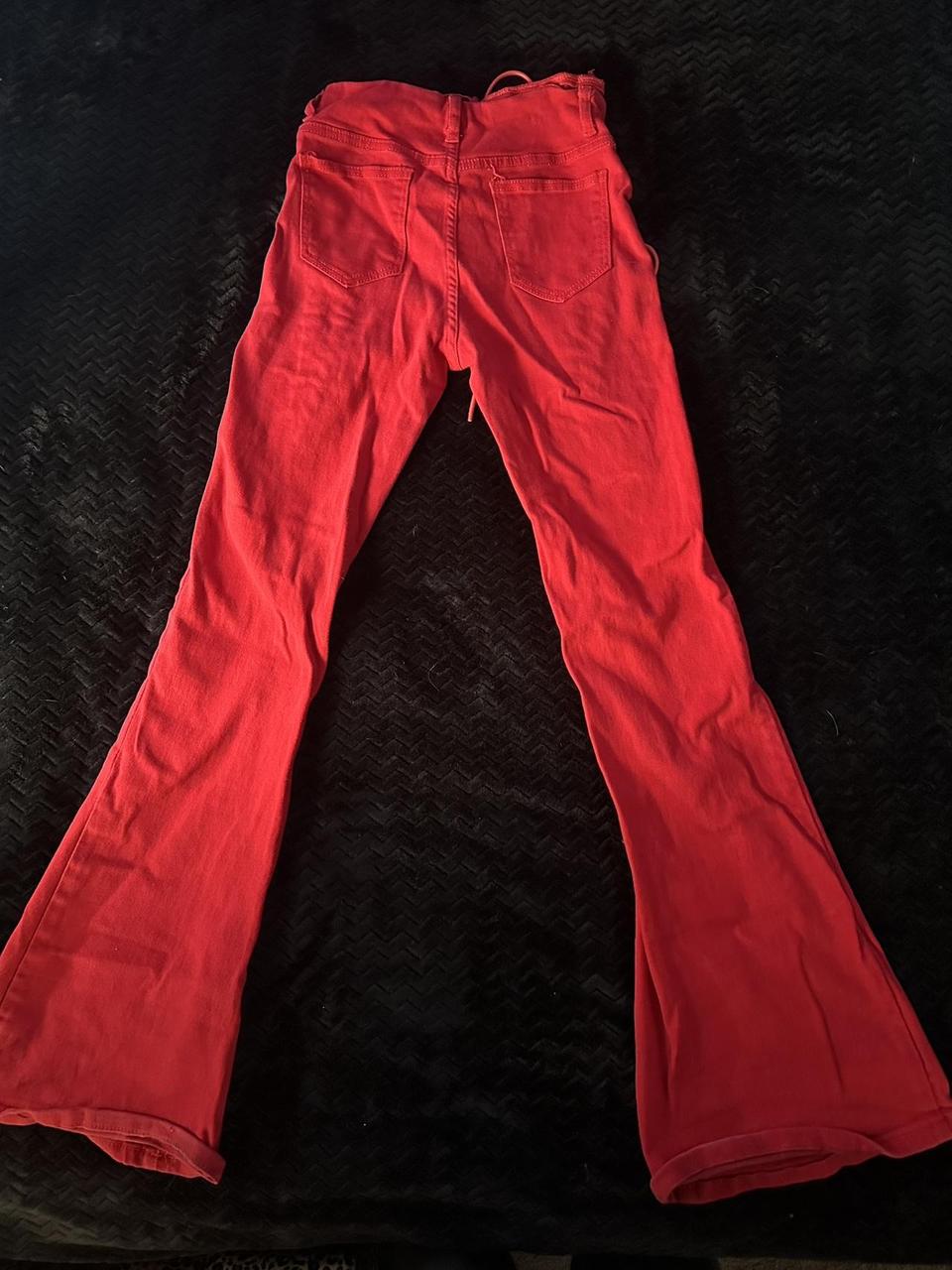 Red flare jeans with lace-up details... - Depop