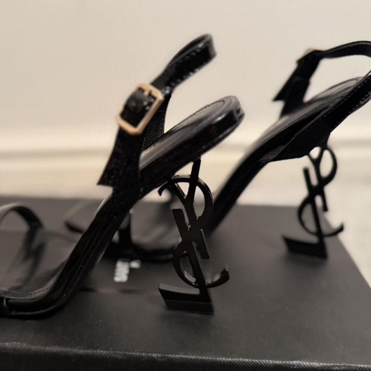 Black leather YSL sandals with gold accents.... | Depop