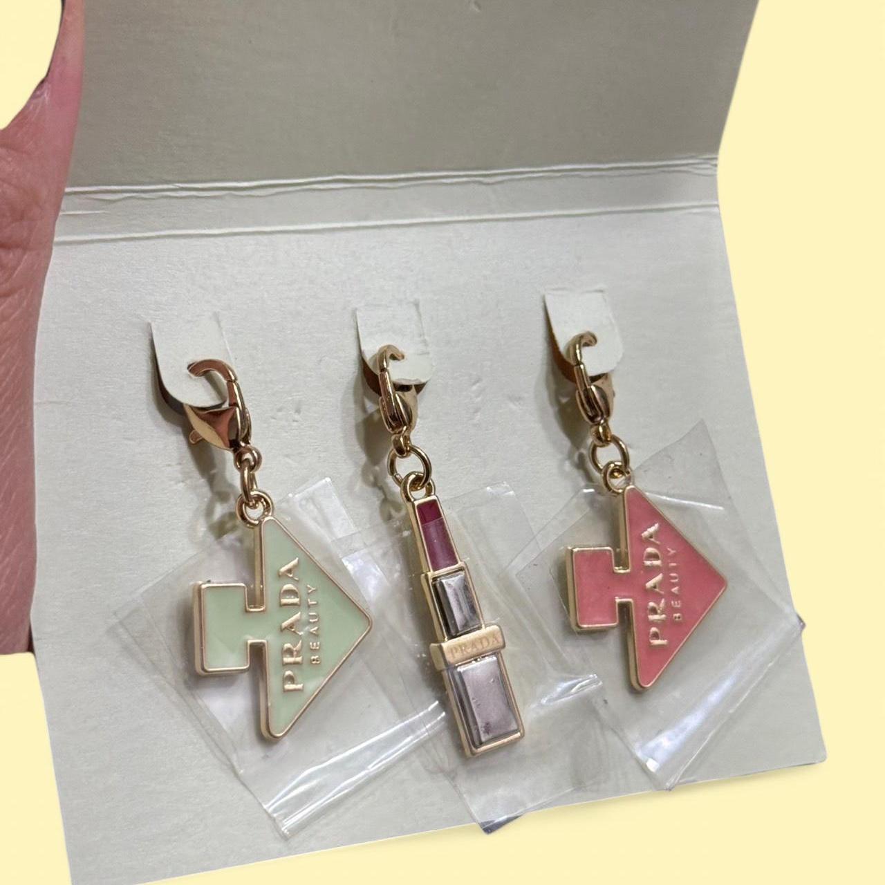 Authentic Prada beauty charms metal brand new | Depop