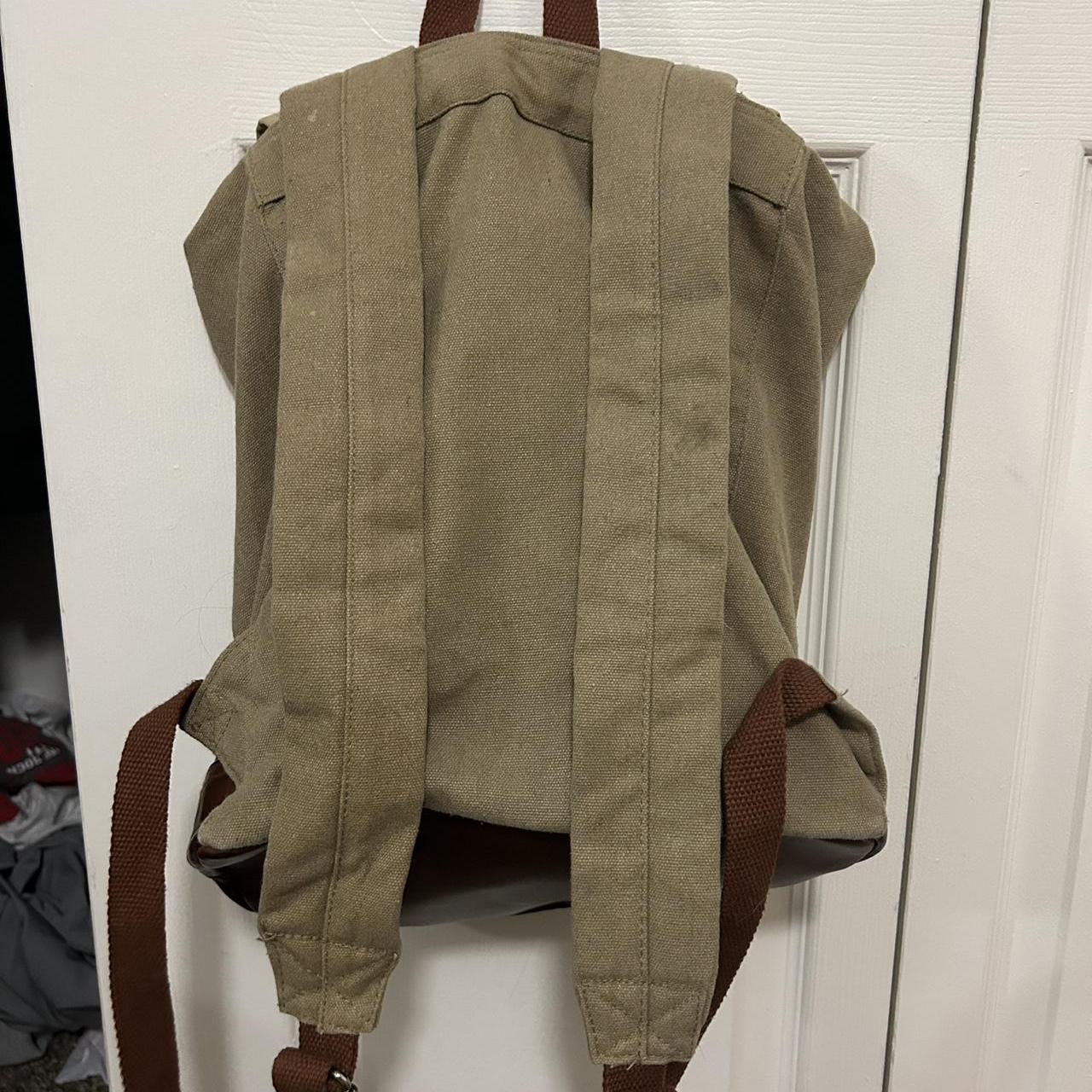 Brown and tan canvas backpack with leather accents... | Depop