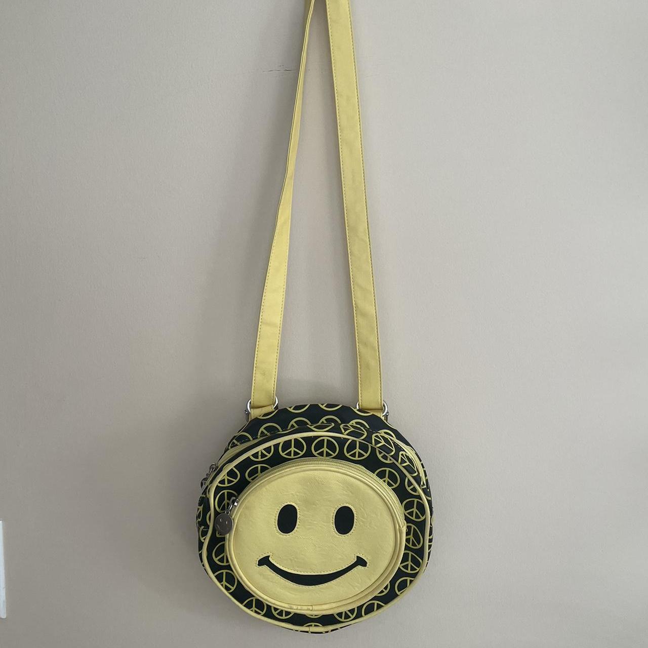 This adorable smiley face yellow festival bag is not... - Depop