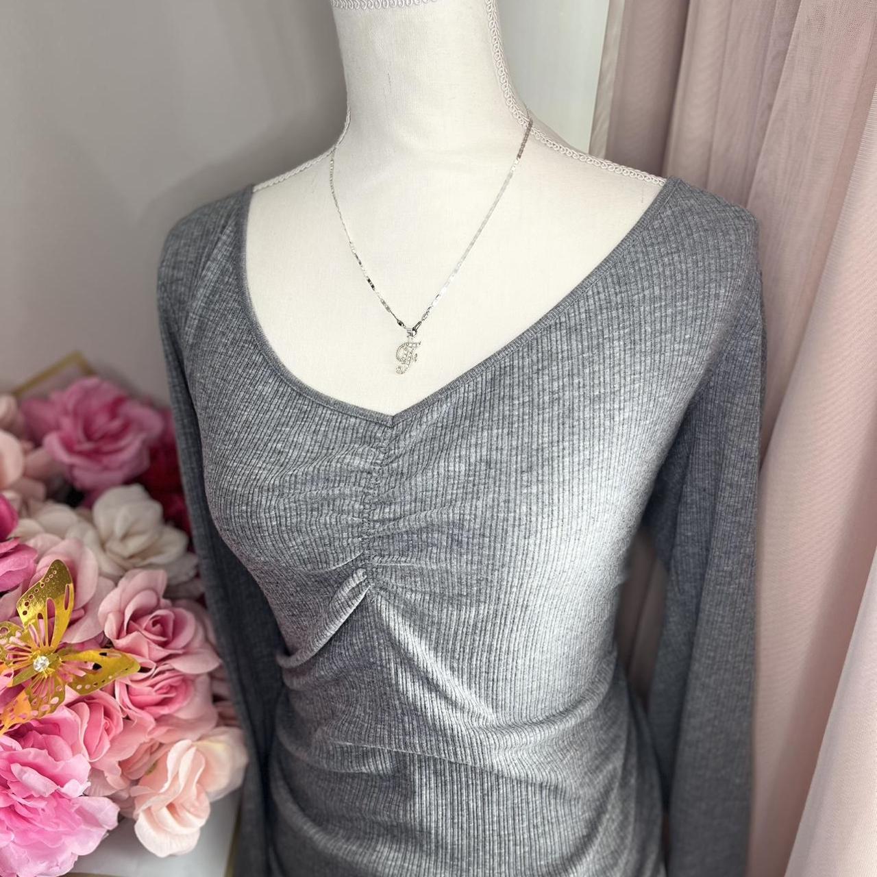 Grey ribbed long sleeve top with a flattering... | Depop