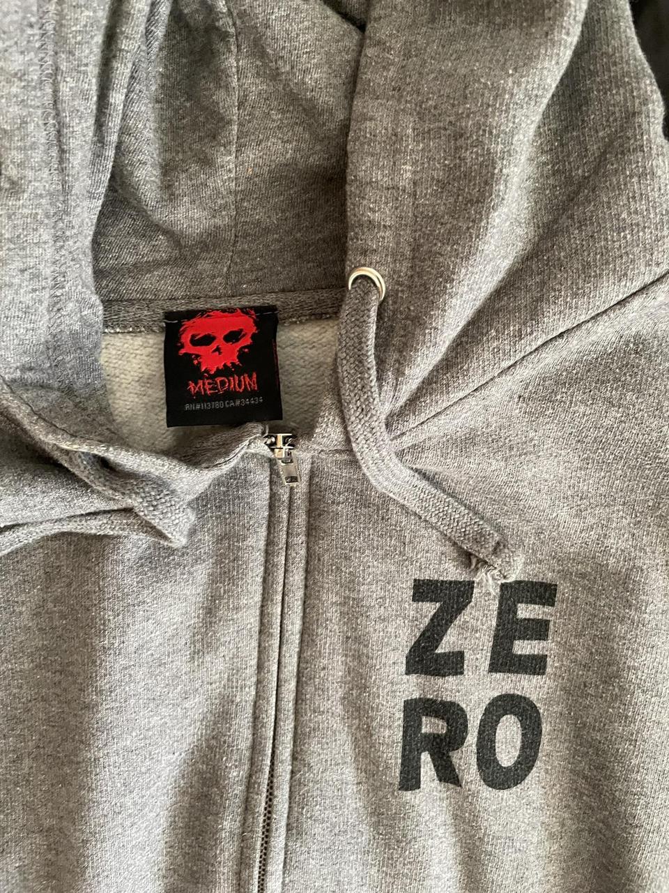 Grey zero zip up hole on left sleeve - Depop