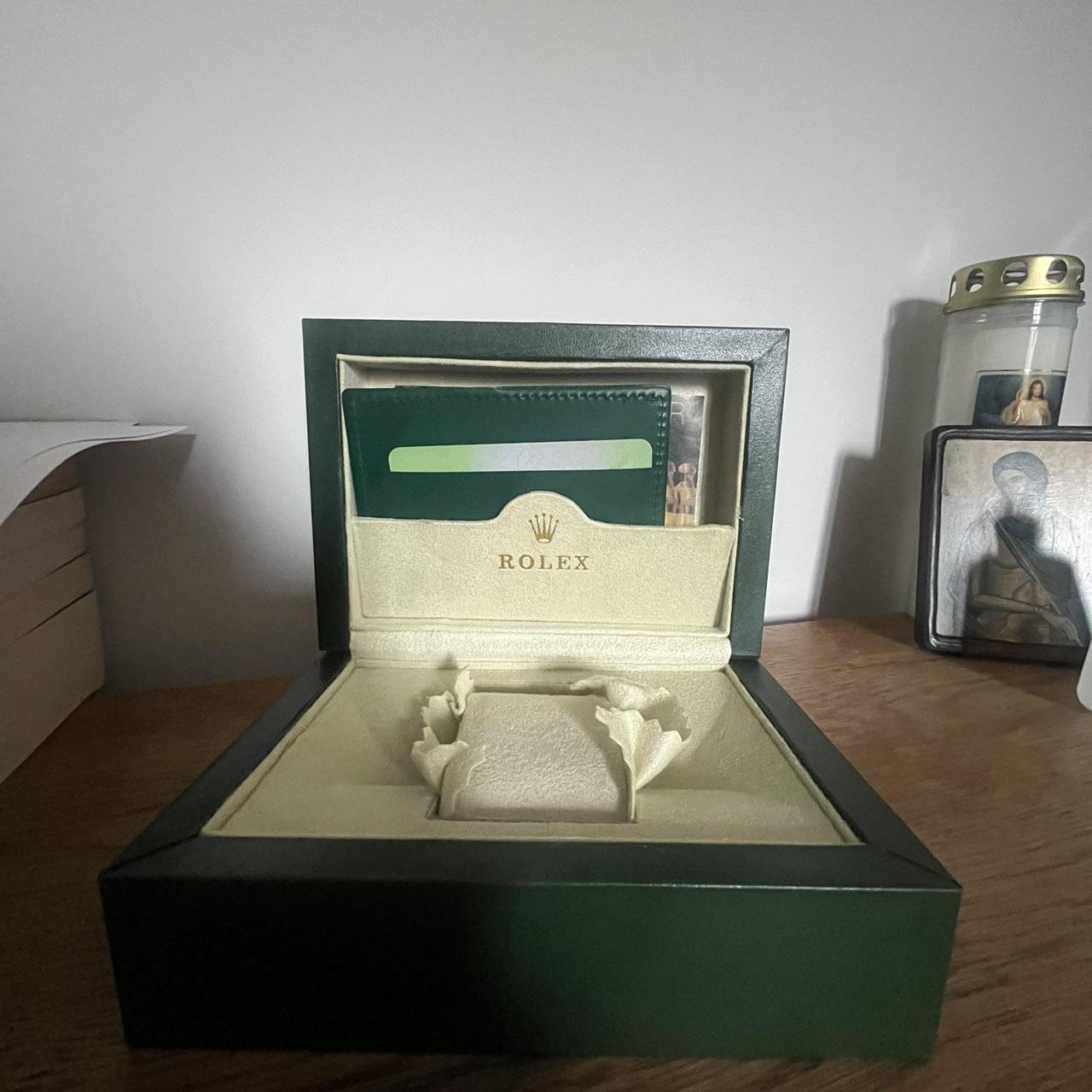 empty Rolex box has a small rip in the back - Depop