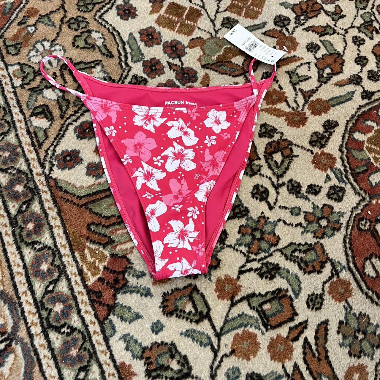 pink and white bikini bottoms with floral print from... - Depop