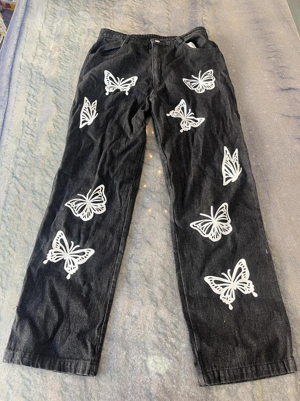 Medium black butterfly jeans - Depop