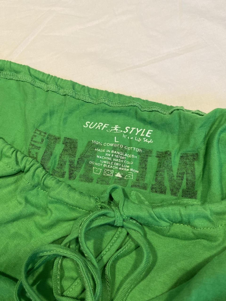 Surf Style green mini skirt with ruffles and graphic... - Depop