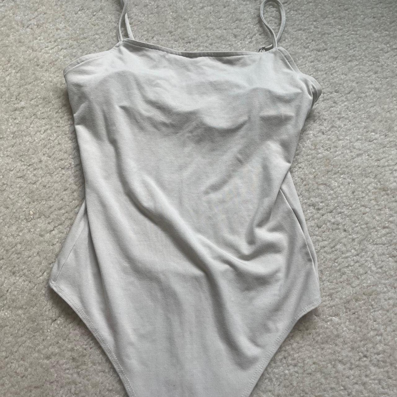 American eagle biege tank body suit in a size small | Depop