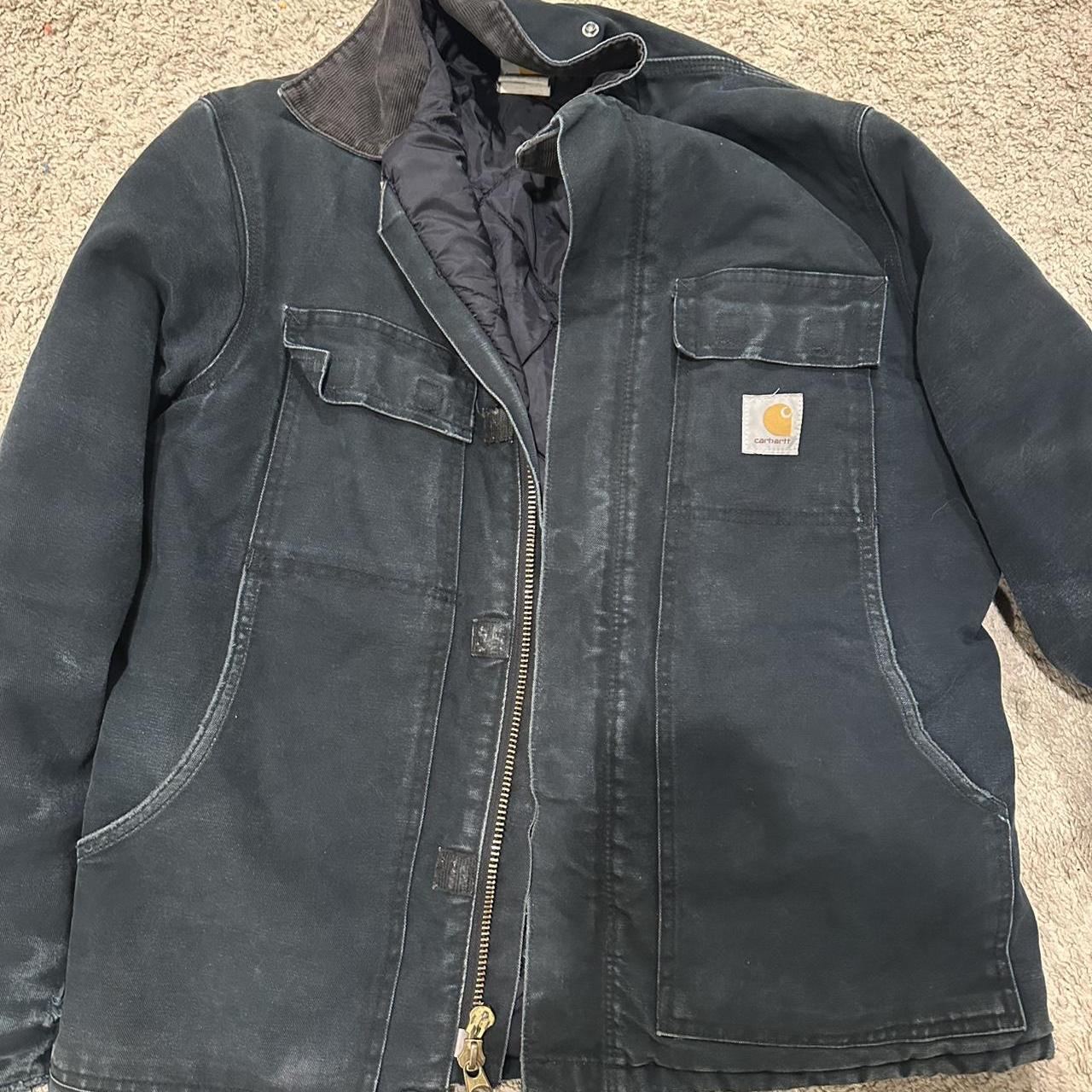 Black Carhartt jacket with a worn look... | Depop