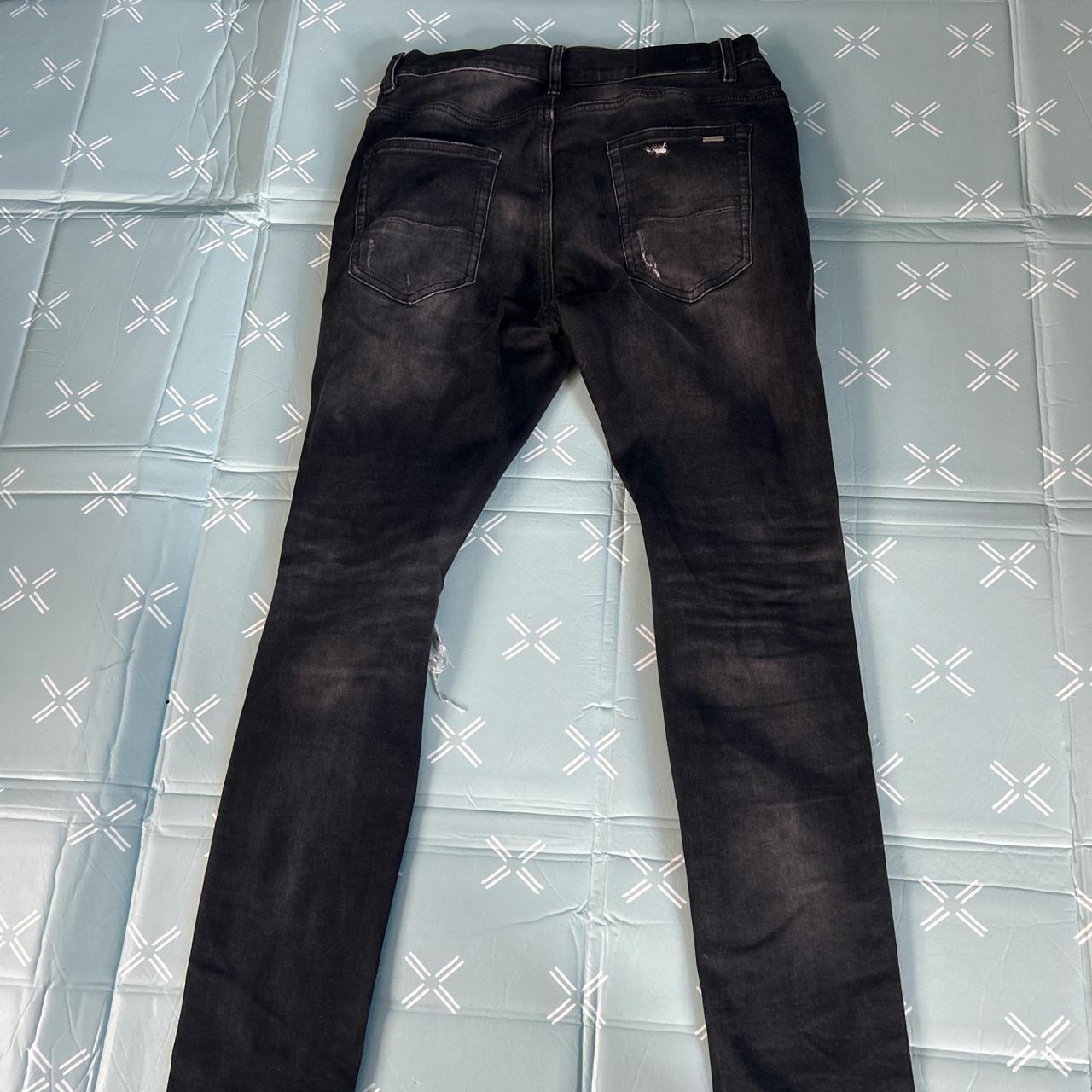 Black Amiri ripped bandana style skinny jeans... | Depop