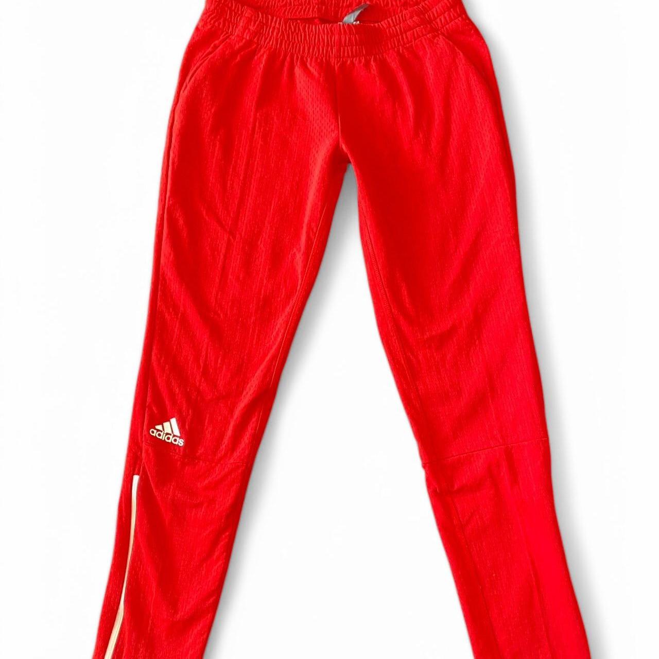 Red Adidas track pants with embroidered logo and... | Depop