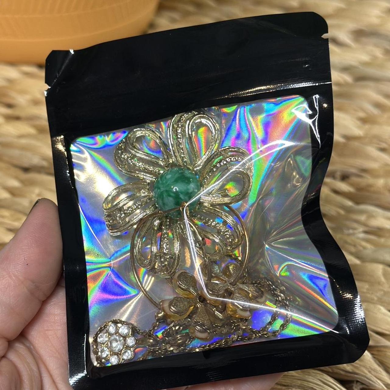 Gold toned flower jewelry grab bag | Depop