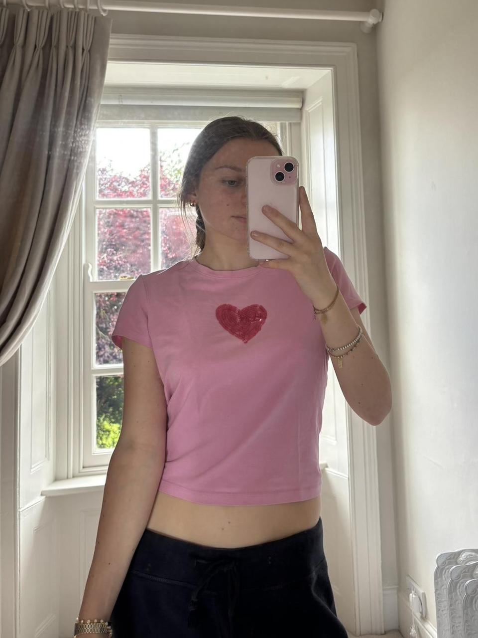 Pink baby tee with heart detail. Super cute. Seen on... - Depop