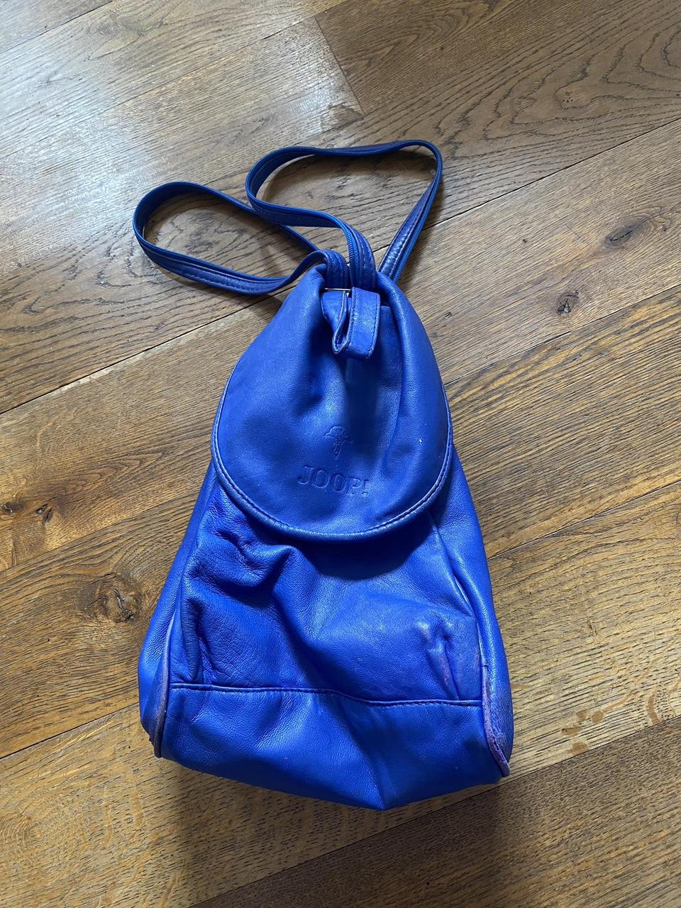 Blue leather mini backpack Signs of use Markings and... - Depop