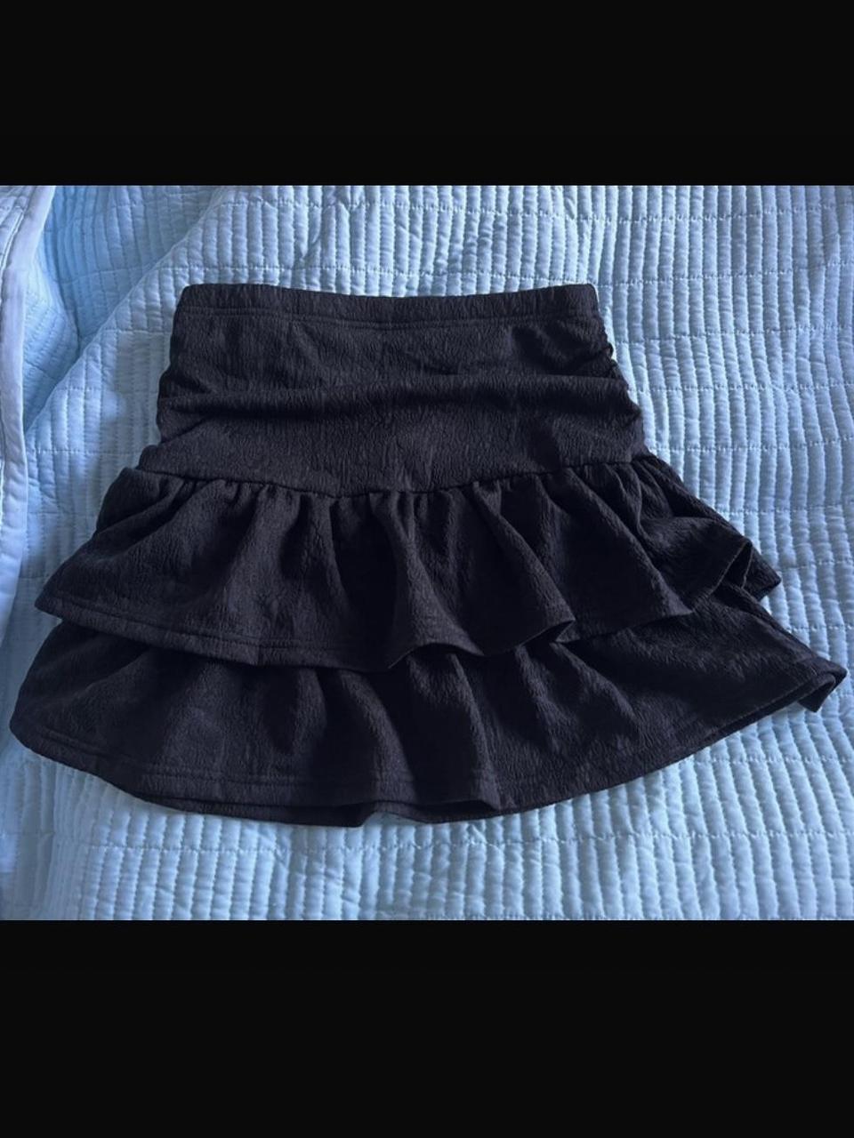 Black ruffle skort Stretchy so would fit a 8-12 - Depop